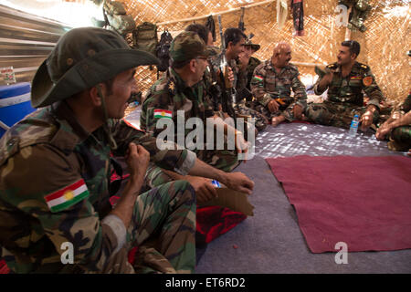 Peshmerga fighters stand ready at the Al Rash front line against ISIS ...