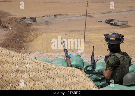 Peshmerga fighters stand ready at the Al Rash front line against ISIS ...