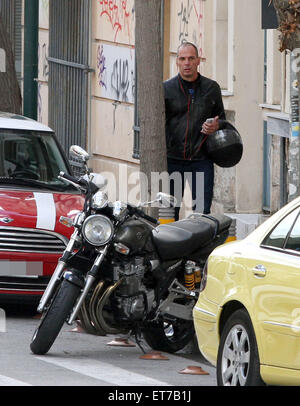 Yanis Varoufakis walks to his motorcycle parked near his home. The ...