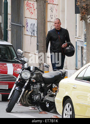 Yanis Varoufakis walks to his motorcycle parked near his home. The ...