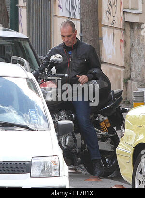 Yanis Varoufakis gets on his motorcycle parked near his home. The Stock ...