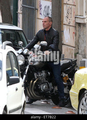 Yanis Varoufakis gets on his motorcycle parked near his home. The Stock ...