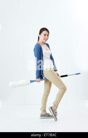 smiling asian woman with mop cleaning at home Stock Photo - Alamy