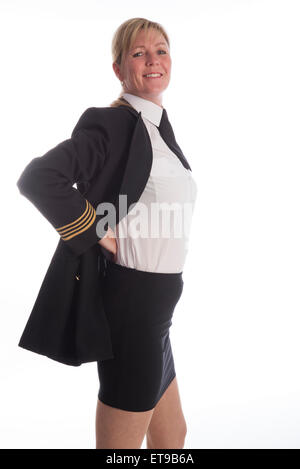 Attractive female airline pilot getting dressed Buttoning her uniform ...