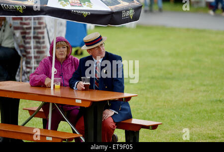 man drinking beer in the rain in a pub beer garden Stock Photo - Alamy