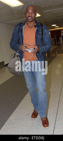 Basketball player Corey Maggette departs from Los Angeles International ...