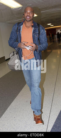 Basketball player Corey Maggette departs from Los Angeles International ...