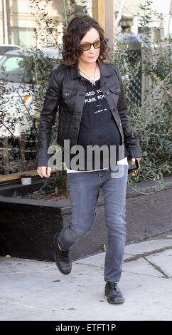 Heavily pregnant Sara Gilbert taking some long strides as she walks ...