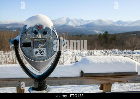 Snow covered coin-operated viewer at a South Rim Grand Canyon overlook ...