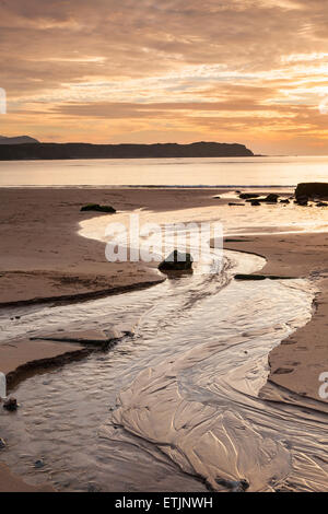 Rocks on Five Fingers Strand at sunset, Trawbreaga Bay and Dunaff Head ...