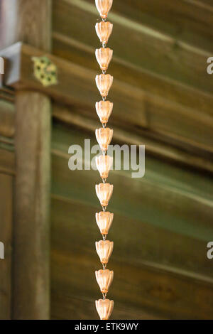 A Japanese rain chain or kusari-doi which is a traditional rain ...