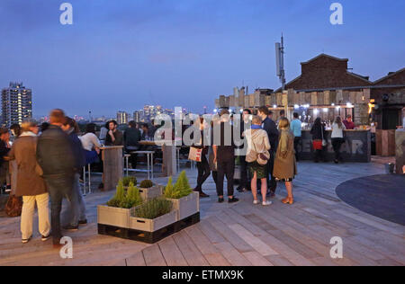 Customers drinking at the Roof top bar at Peckham's Bussey Building - a ...
