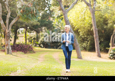 Photo of pretty cute retired woman blue sweater showing okey sign ...