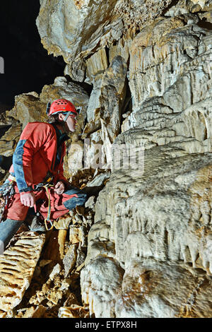 Cave explorer in front of sinter cascades Stock Photo - Alamy