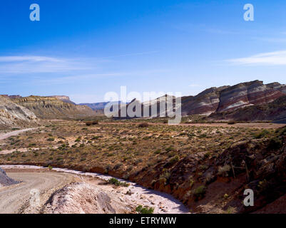 The colorful Bentonite Hills and Wood Bench near Hanksville, Utah Stock ...
