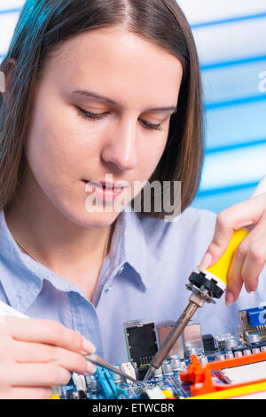 Girl debugging an electronic precision device Stock Photo - Alamy