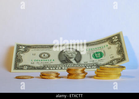 Savings over time gold vs paper currency concept Stock Photo - Alamy
