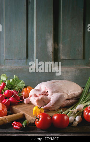 Raw young duck on wooden cutting board. wooden background. Top view ...