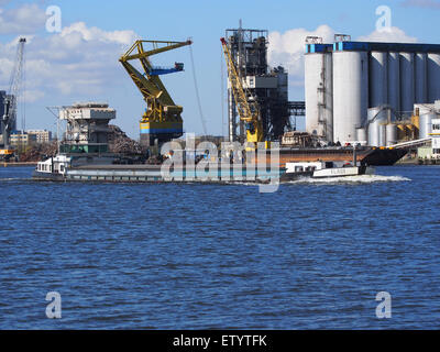 This image shows an oil tanker in convoy with a cargo vessel during ...
