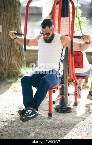 Bodybuilding training, bearded strong sportsman with muscular body ...