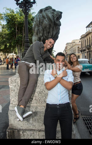 Three young Latin people having fun Stock Photo - Alamy