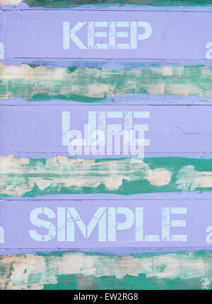 Keep it simple words on wooden blocks on dark gray background. Business ...