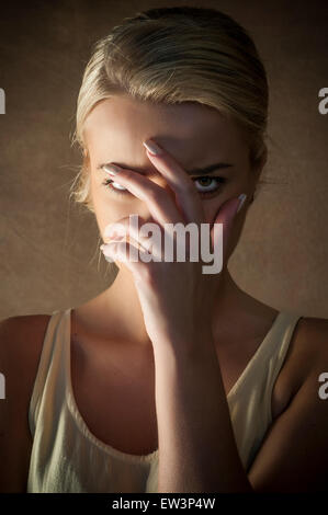 mysterious woman hiding face and identity behind mask Stock Photo - Alamy