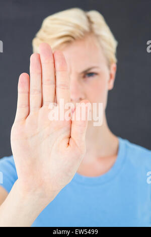 Stern woman gesturing with her hand Stock Photo - Alamy