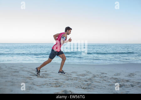 Handsome fit man running Stock Photo - Alamy
