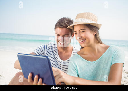 Happy couple using a tablet computer Stock Photo - Alamy