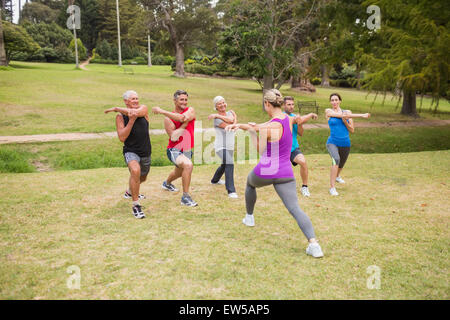 Happy athletic group training Stock Photo - Alamy
