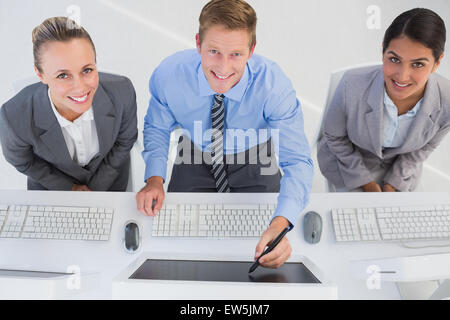Businessman showing his screen to the team Stock Photo - Alamy