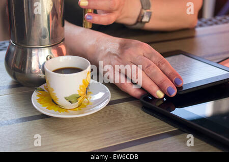 Female hands with tablet computer on grey grunge background. Concept of ...