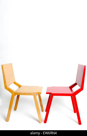 Two modernistic designer wooden chairs Stock Photo - Alamy