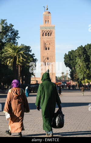 Locals wearing long-hooded cloak known as a djellaba, worn by both male ...