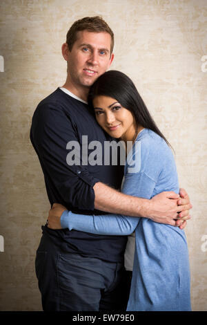 Enamoured couple hugging Stock Photo - Alamy