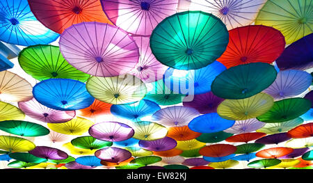 Colorful decorative umbrellas hanging from cables Stock Photo - Alamy