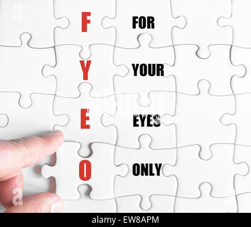 Business Acronym FYEO as For Your Eyes Only. Yellow paint line on the ...