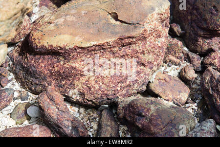 Red crystals closeup, spinel, ruby or granate and green spots in ...