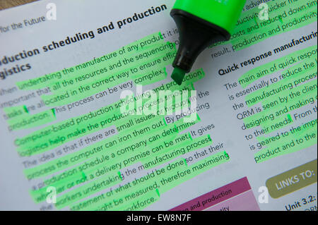 Highlighter pens on A level homework and revision Stock Photo - Alamy