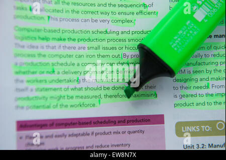 Highlighter pens on A level homework and revision Stock Photo - Alamy