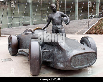 Statue of racing driver Juan Manuel Fangio outside of the Mercedes-Benz ...