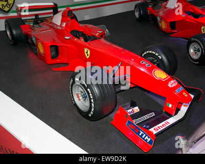 1999 Ferrari F399 Formula 1 car driving up the hillclimb track at the ...