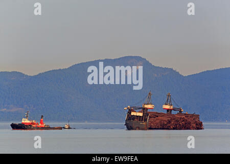 'Seaspan Survivor', a self loading/dumping log barge with its companion ...