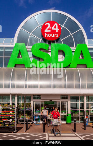 Asda supermarket store entrance with trolleys in car park outside the ...