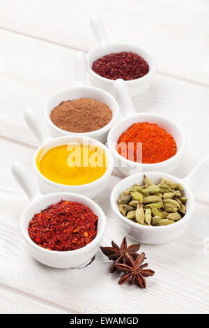Various spices on white wooden background Stock Photo - Alamy