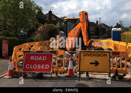 Safety barriers, cones, big hole, road, rubble concrete, tarmac ...