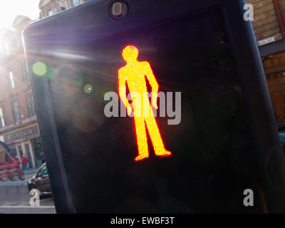 Traffic crossing 'red man' stop light symbol: close-up crop to show ...