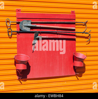 Firefighter shield with fire extinguishing tools in Russian village ...