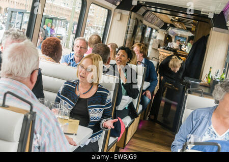 Diners enjoying the service on board the Hoftrammm tram restaurant, Den ...